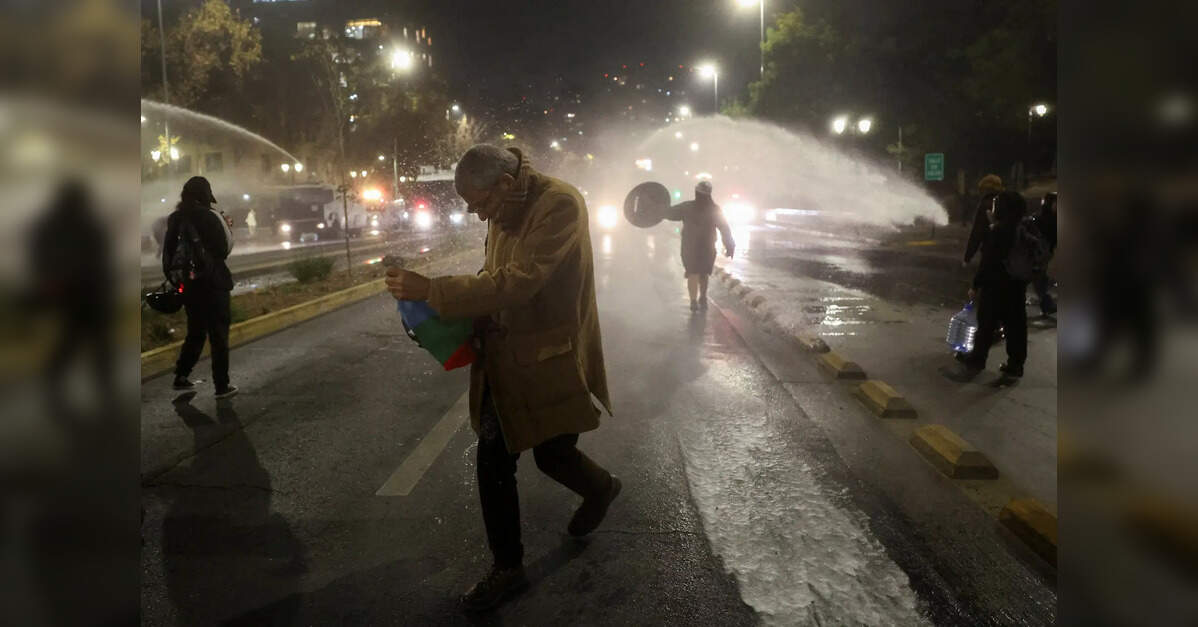 Chile Budget Cuts Protests: Chile police clash with students protesting ...